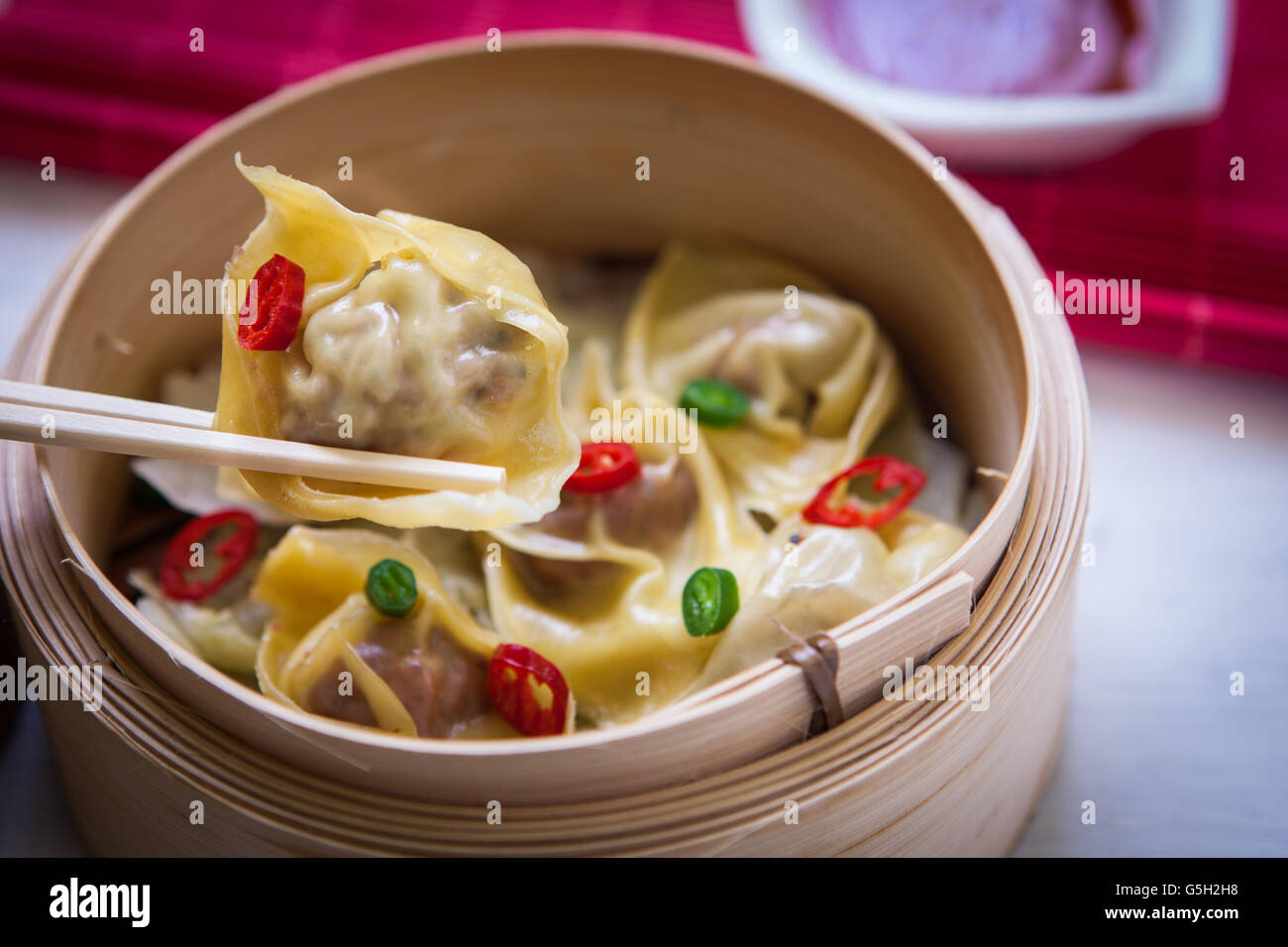 Steamed chinese dimsum on steamer with sweet and sour sauce Stock Photo ...