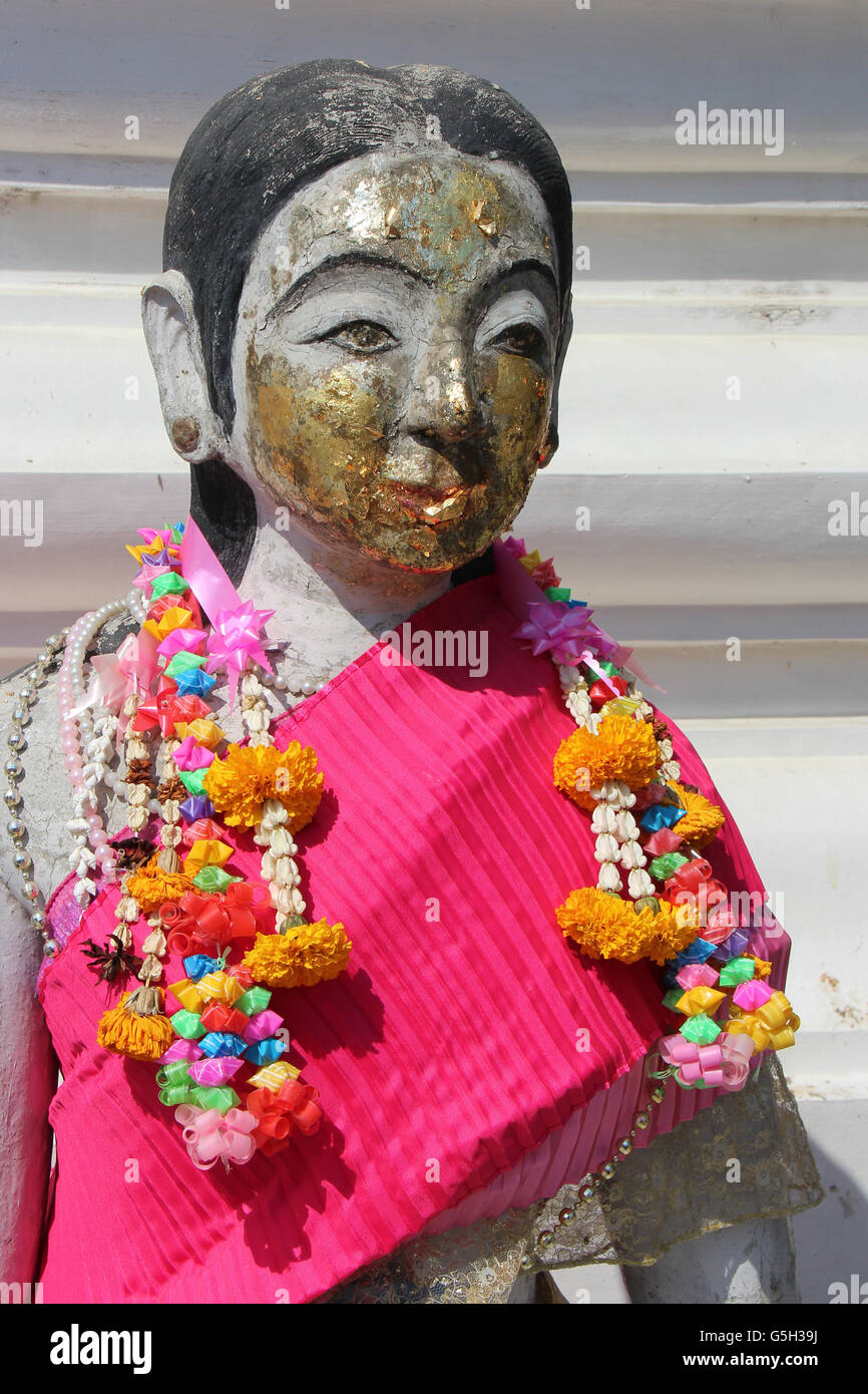 Detail of the statue of a Buddhist female divinity in front of the Wat ...