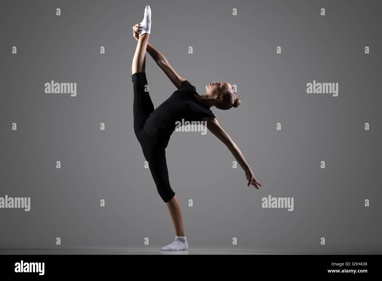 Beautiful cool young fit gymnast athlete woman in sportswear working ...