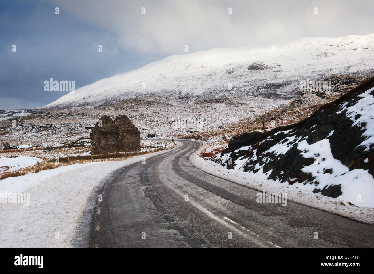 Remote Highland road in winter - Sutherland, Scotland. This road is ...