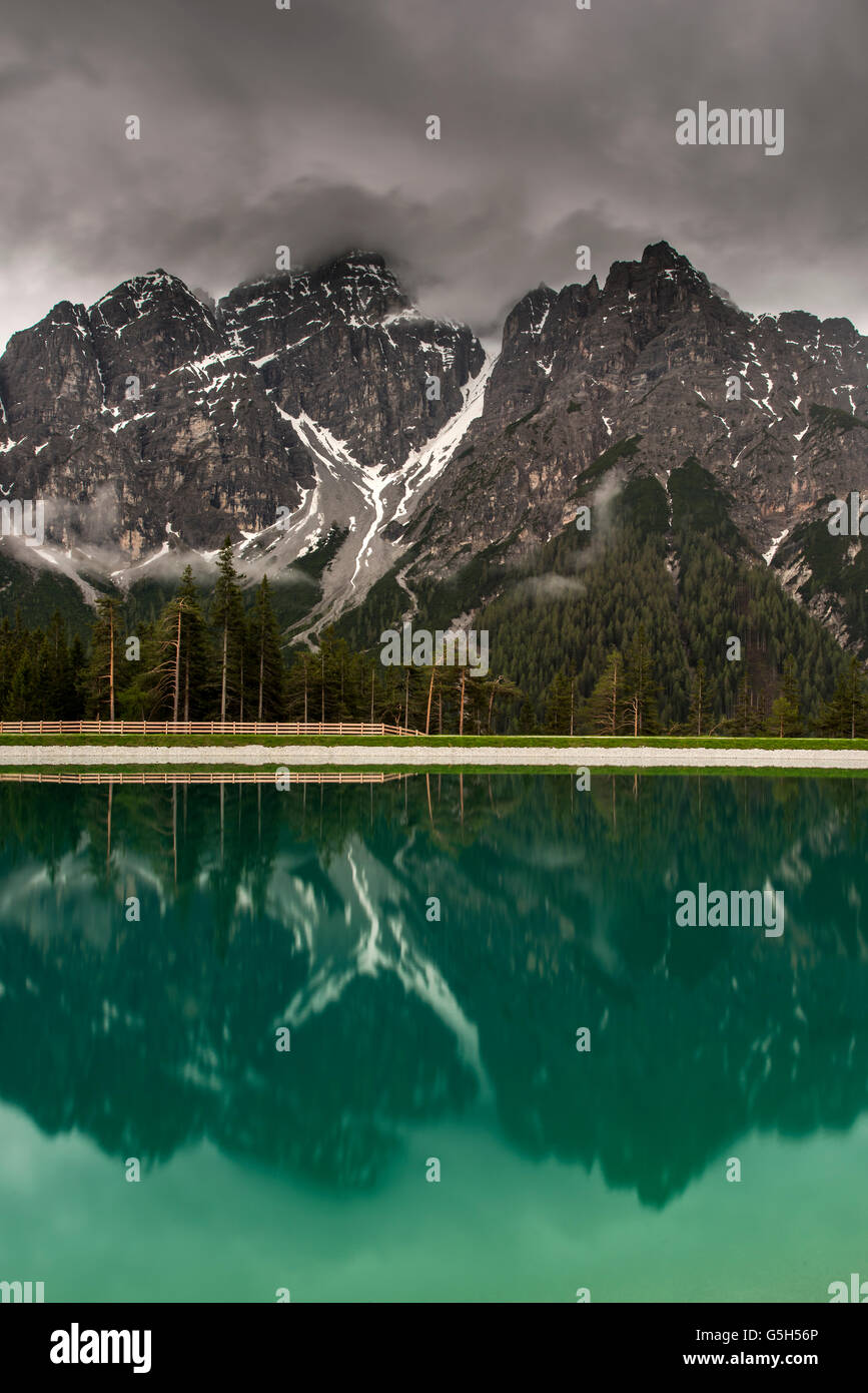 Serles mountain reflected into a small mountain lake, Stubaital valley ...