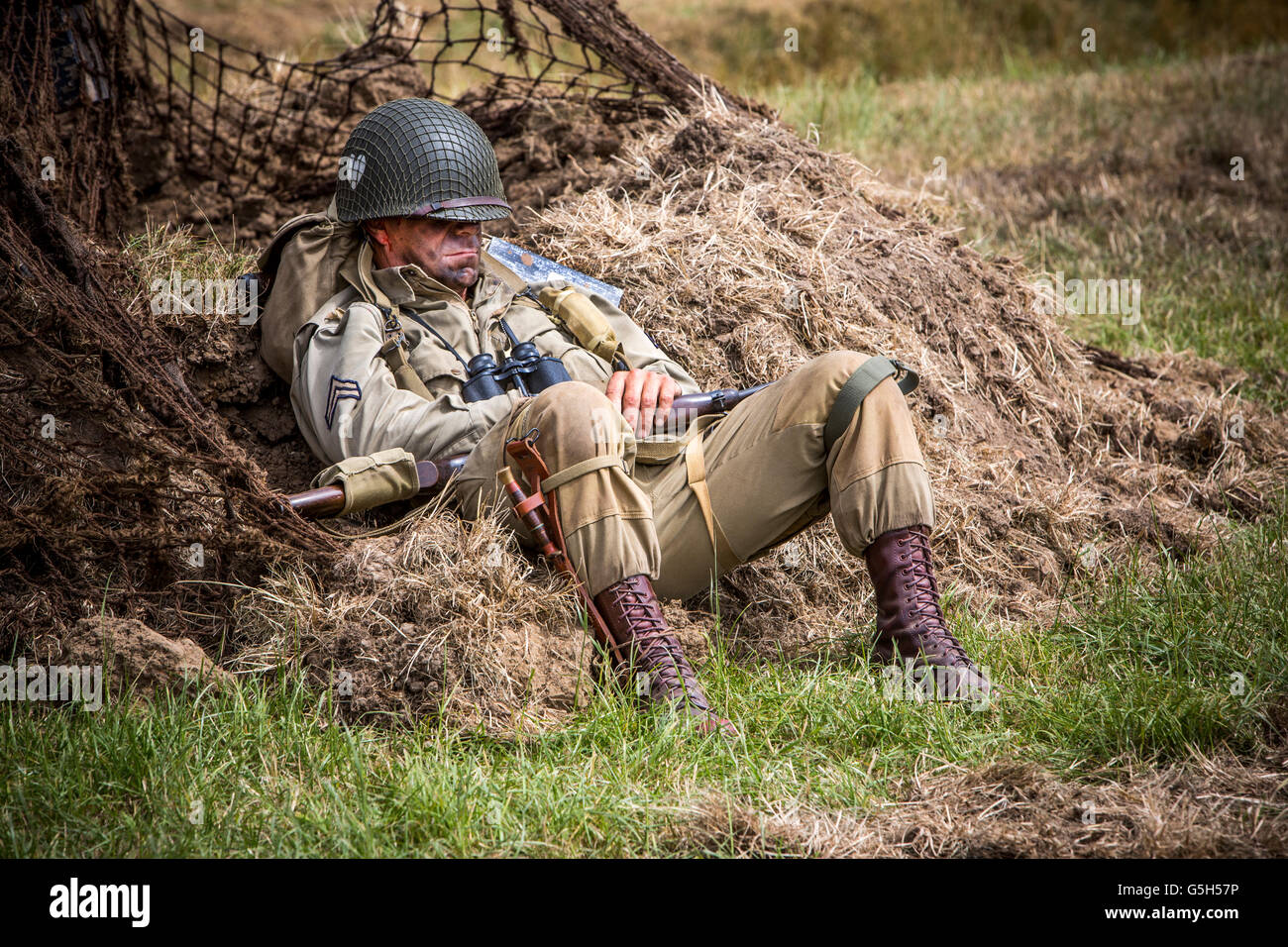 A soldier taking a rest at a reenactment Stock Photo - Alamy