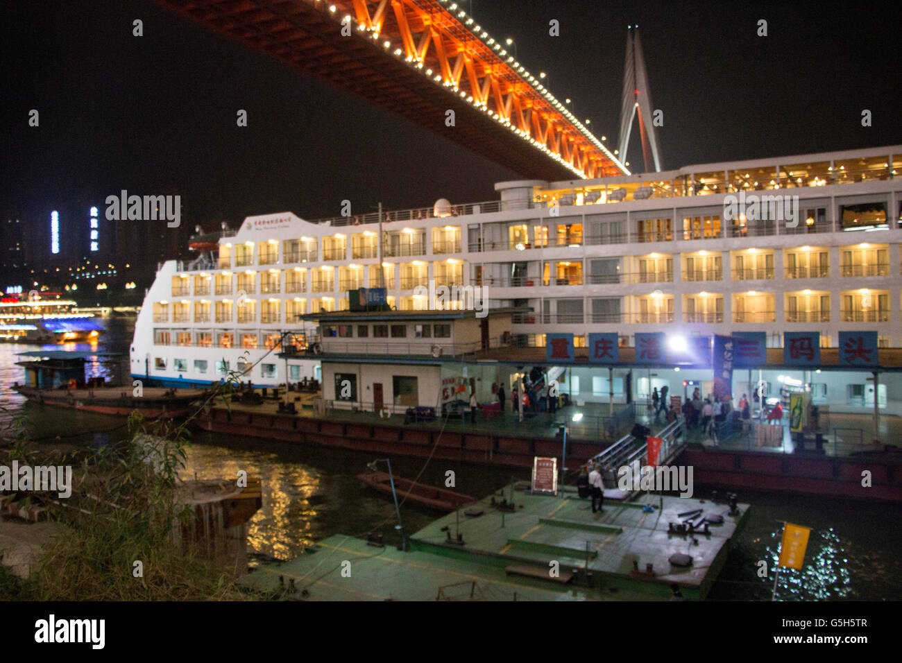 Night view of Chongqing bridge from cruise ship, with illuminated ...