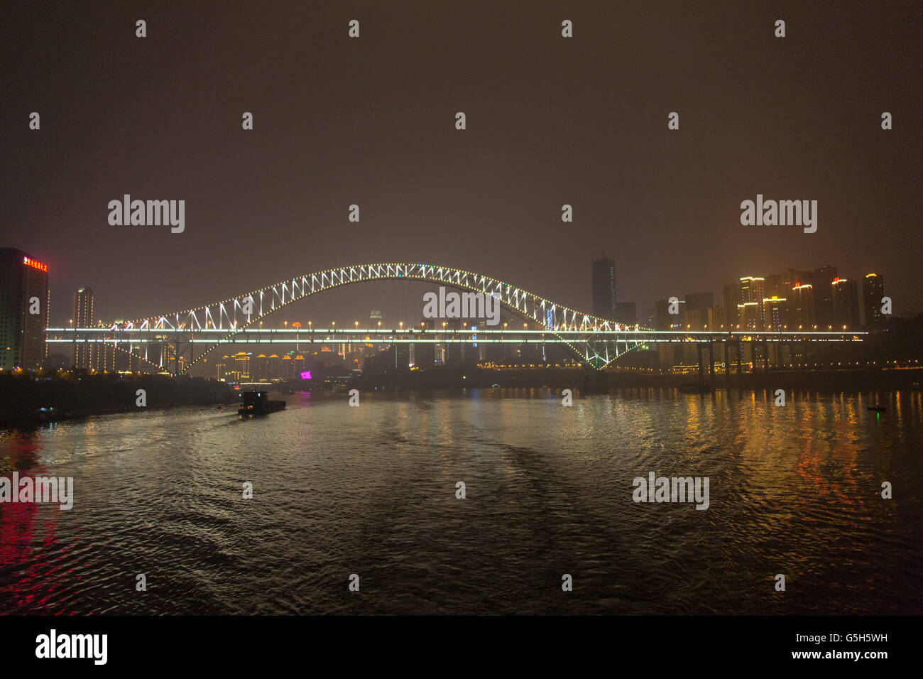 Night view of Chongqing bridge from cruise ship, with illuminated ...