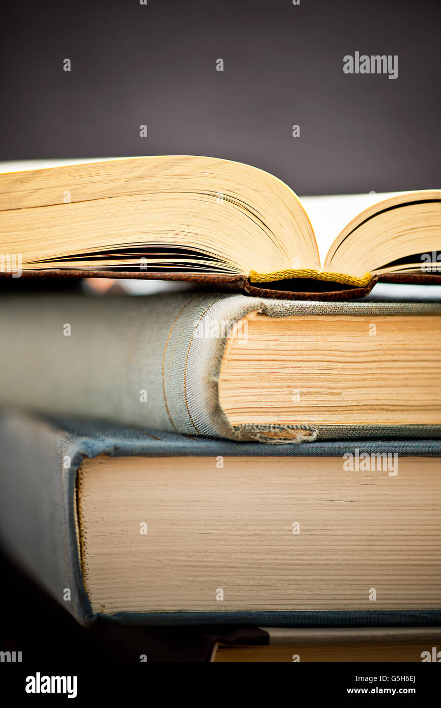 mound of open books on the gray background,shallow depth of field Stock ...