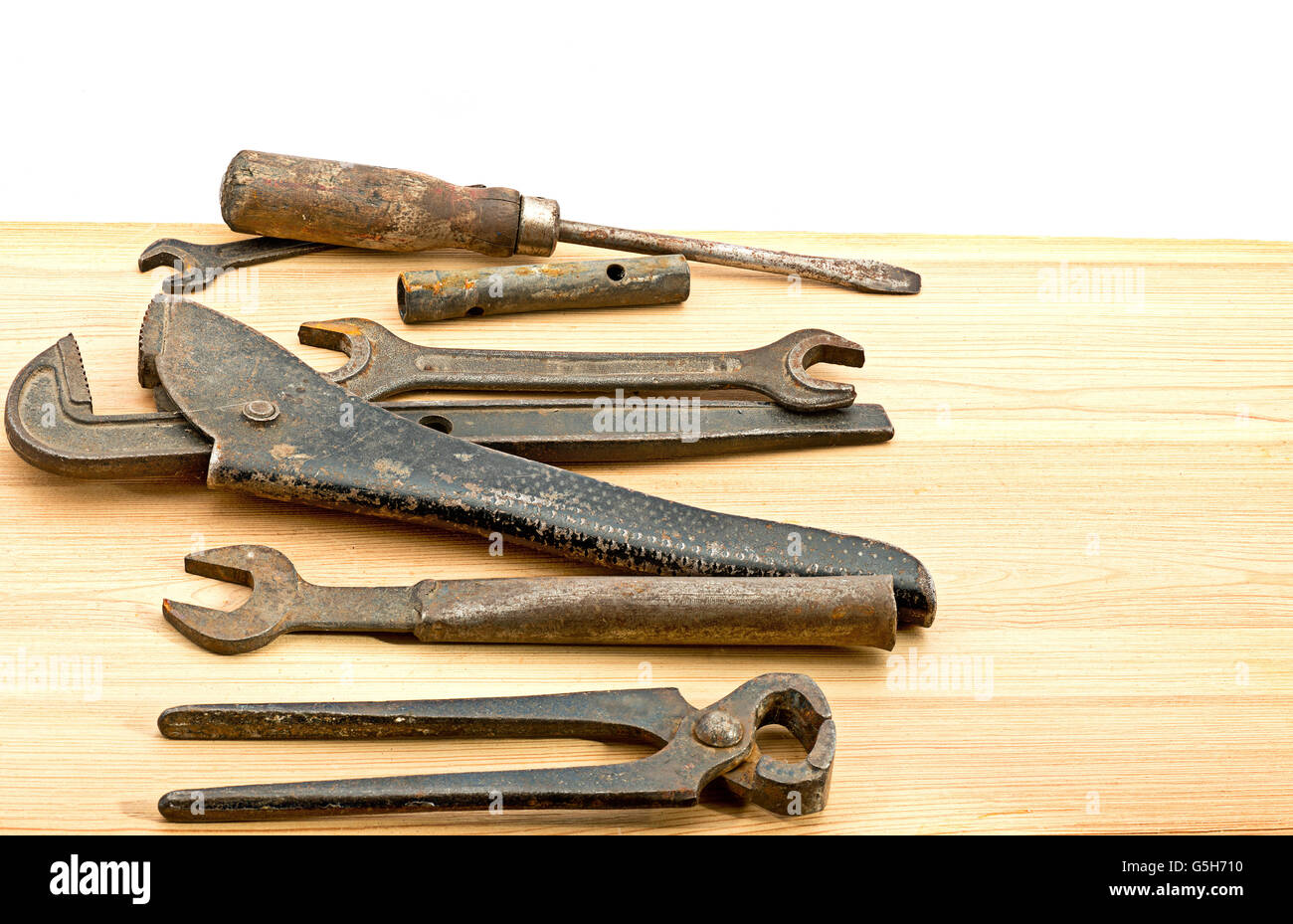 old used tools on the wooden desk Stock Photo - Alamy