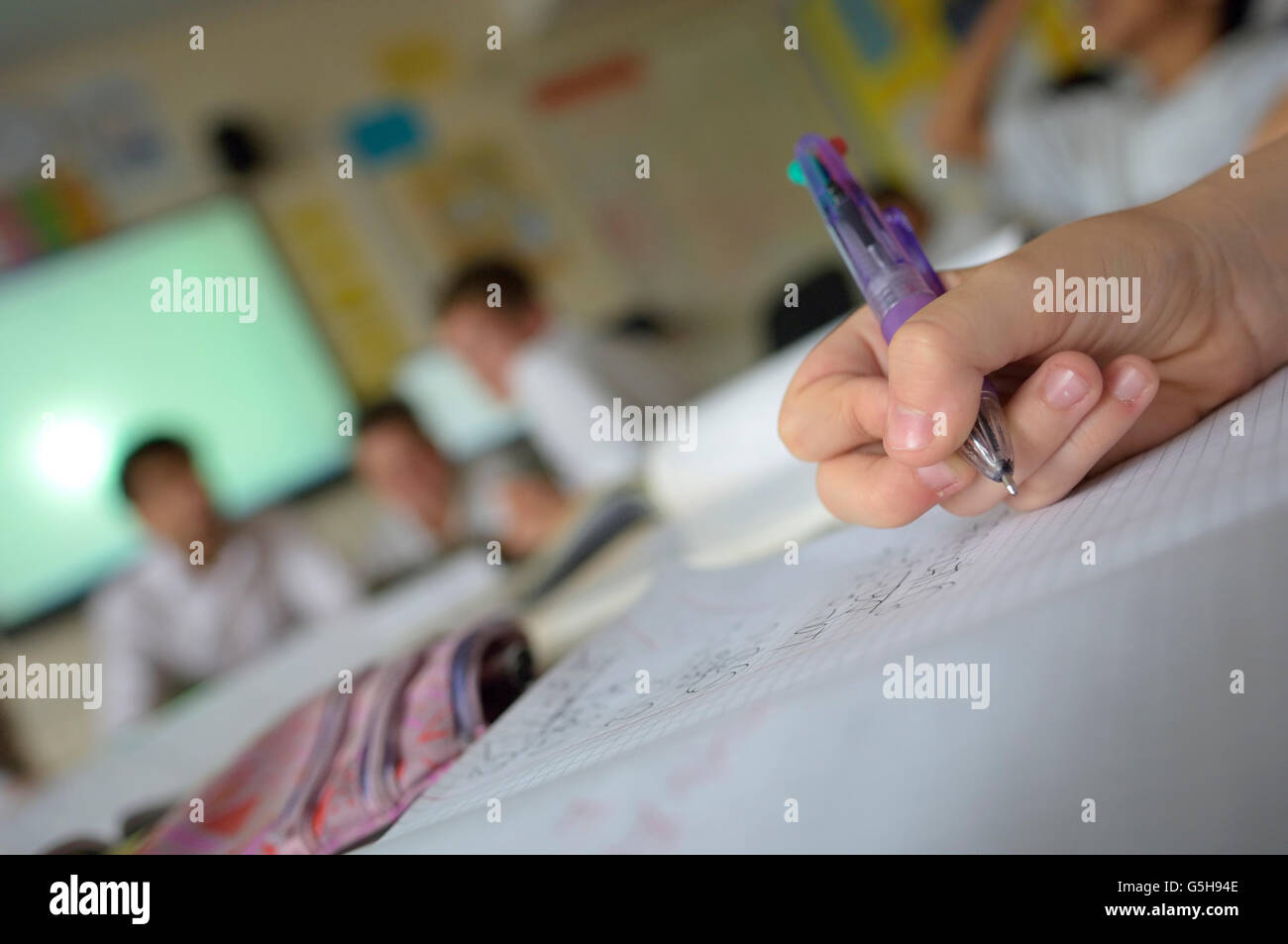 Maths teacher in a secondary school classroom with pupils. England. UK ...