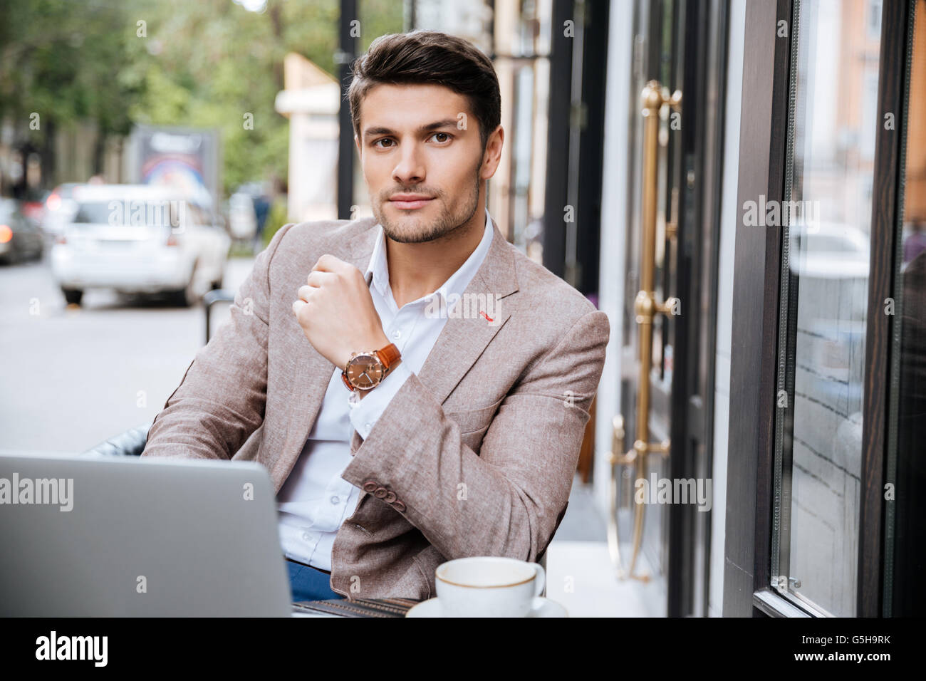 Businessman sitting cafe typing something hi-res stock photography and ...