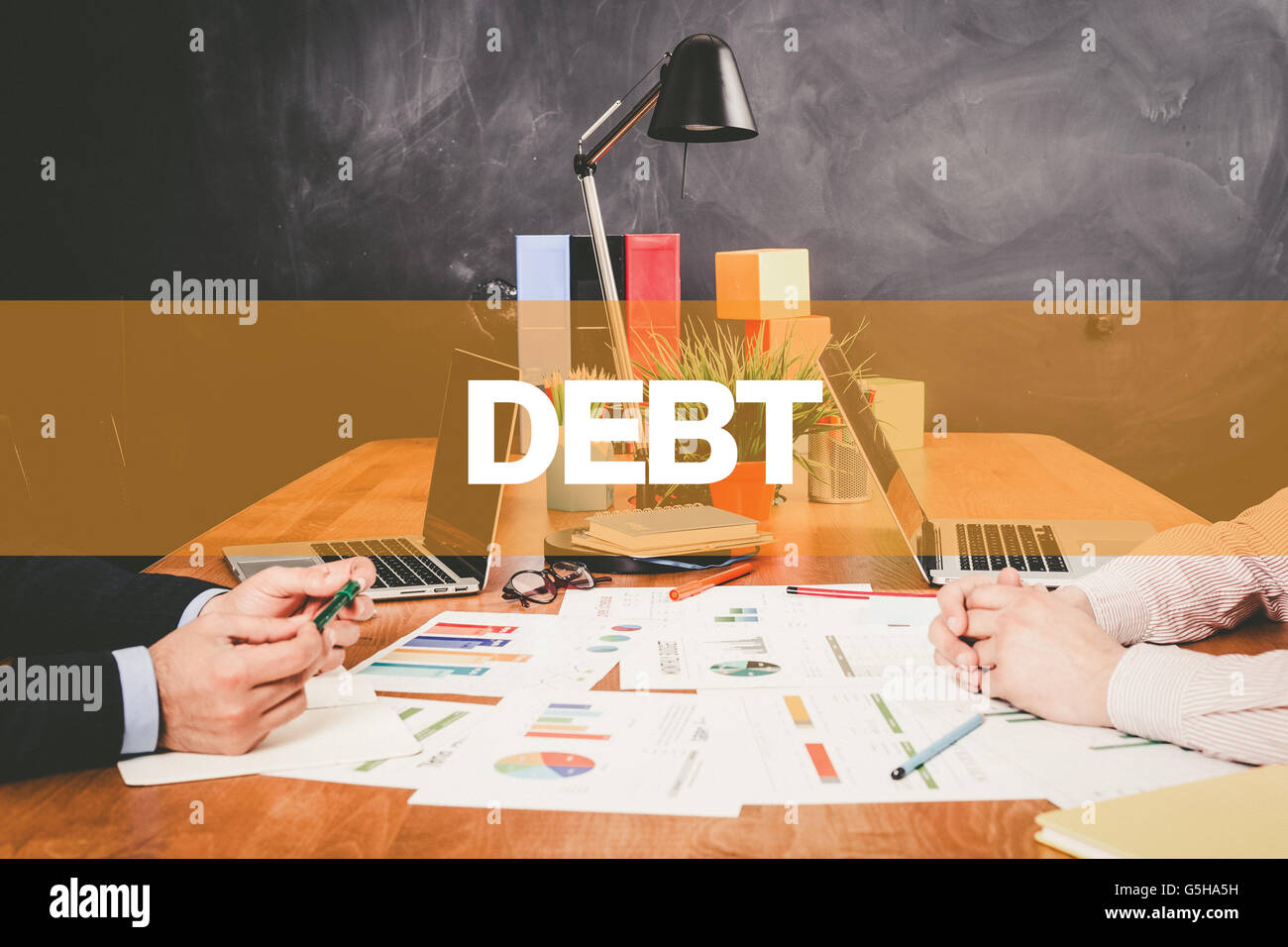 Two Businessman Debt working in an office Stock Photo - Alamy