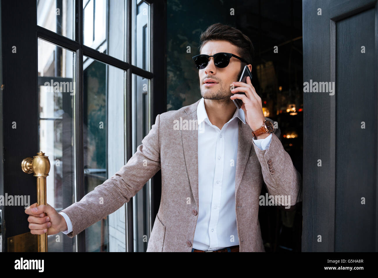 Man walking out door hi-res stock photography and images - Alamy