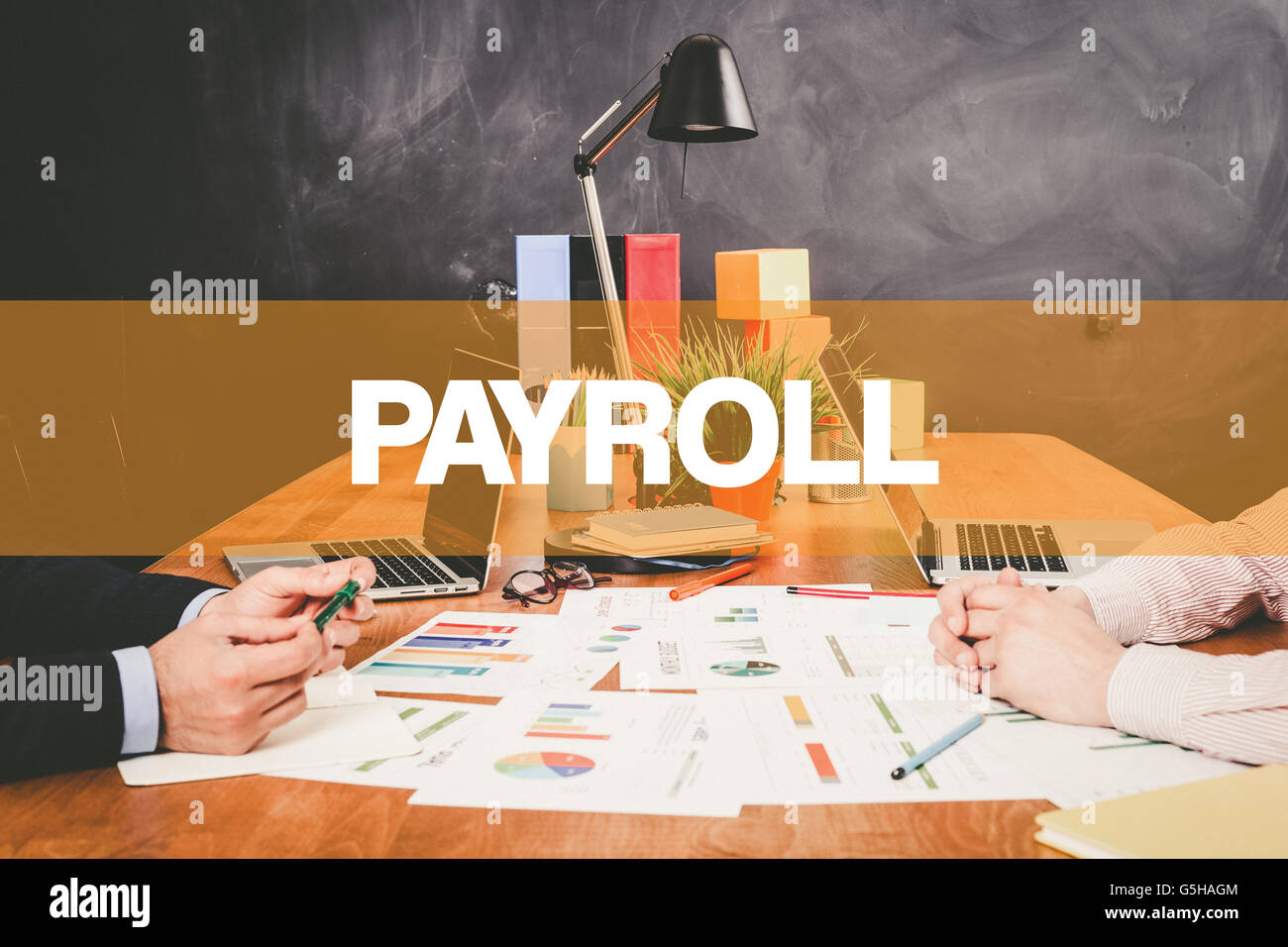 Two Businessman Payroll working in an office Stock Photo - Alamy