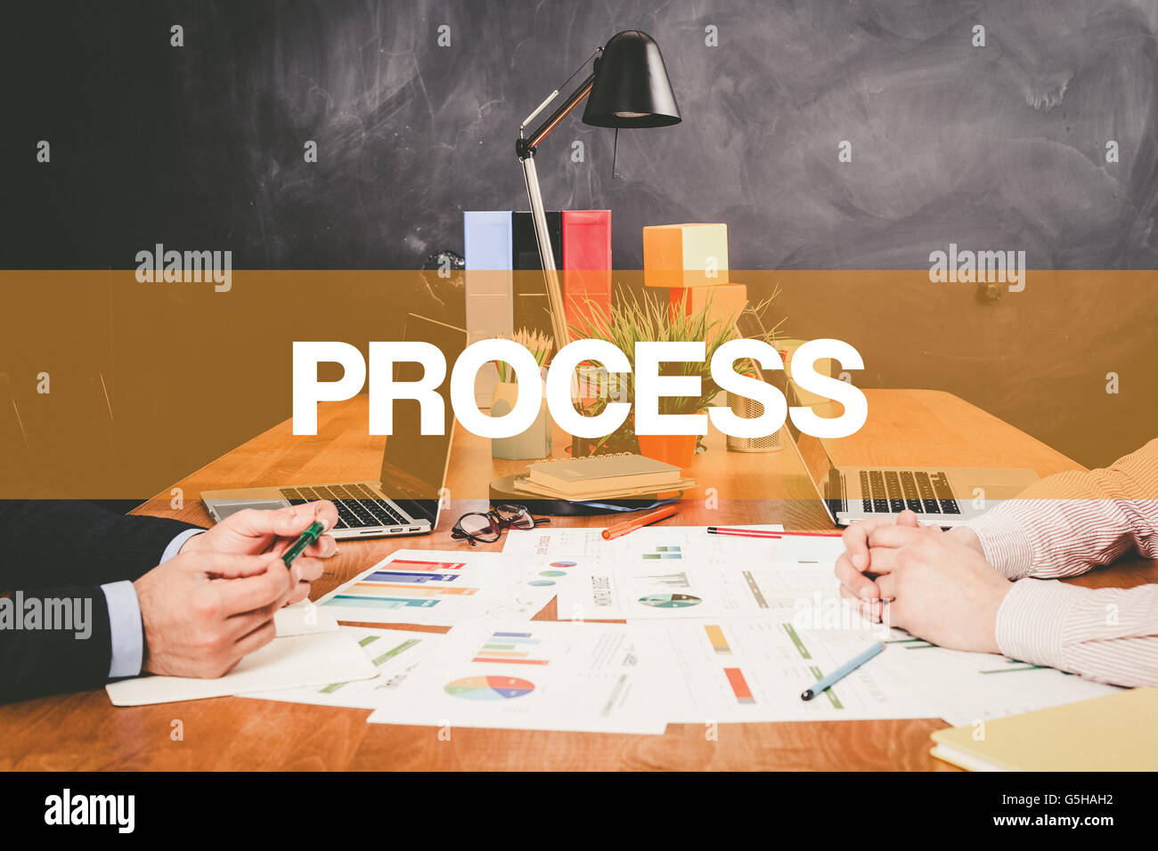 Two Businessman Process working in an office Stock Photo - Alamy