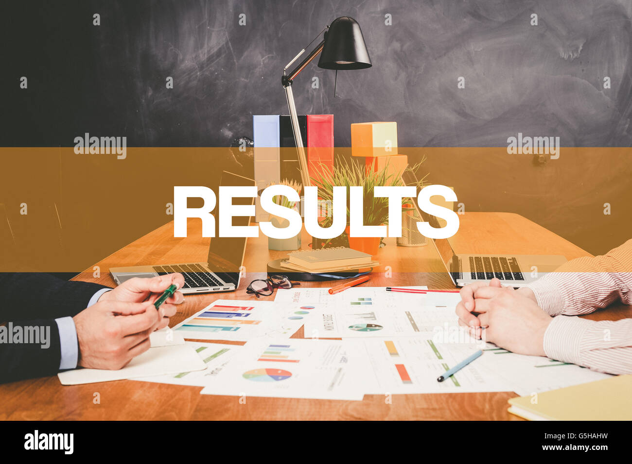 Two Businessman Results working in an office Stock Photo - Alamy