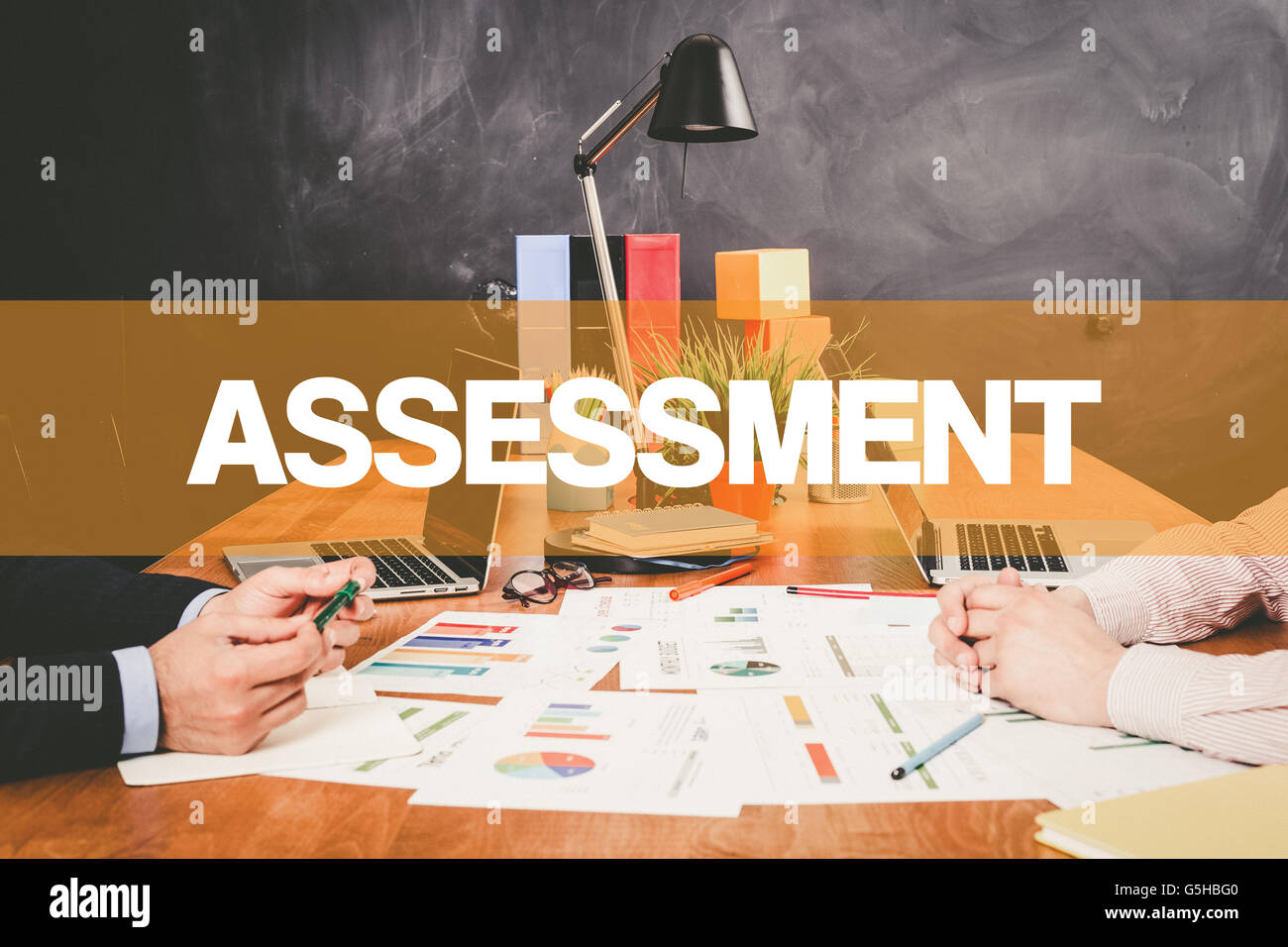 Two Businessman Assessment working in an office Stock Photo - Alamy