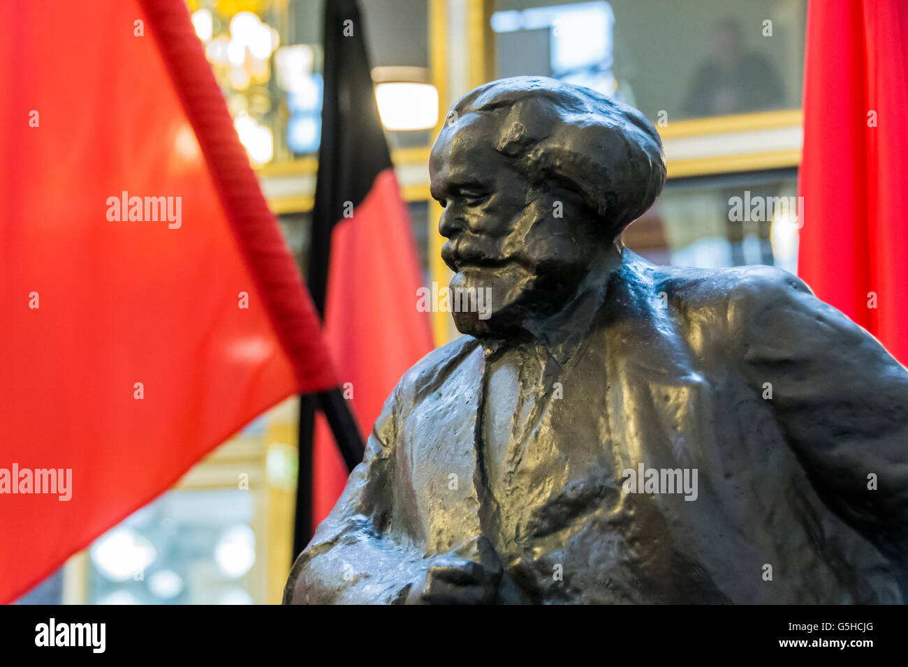 Statue of Lenin with red flag inside the foyer of the Stasi Museum in ...