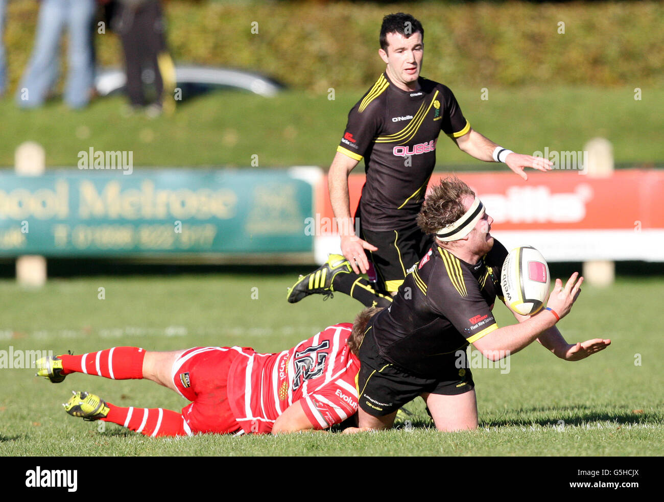 Melrose's Nicky Little (right) is tackled by Llandovery's Jack Roberts ...