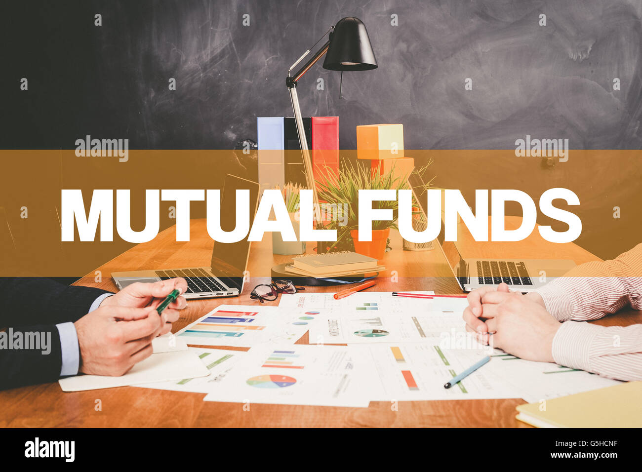 Two Businessman Mutual Funds working in an office Stock Photo - Alamy