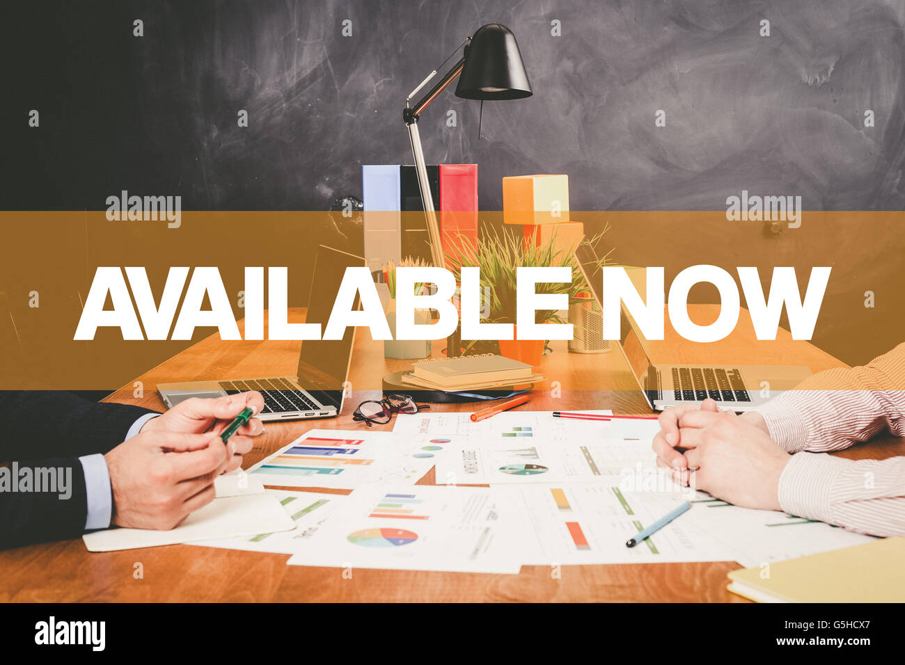 Two Businessman Available Now working in an office Stock Photo - Alamy