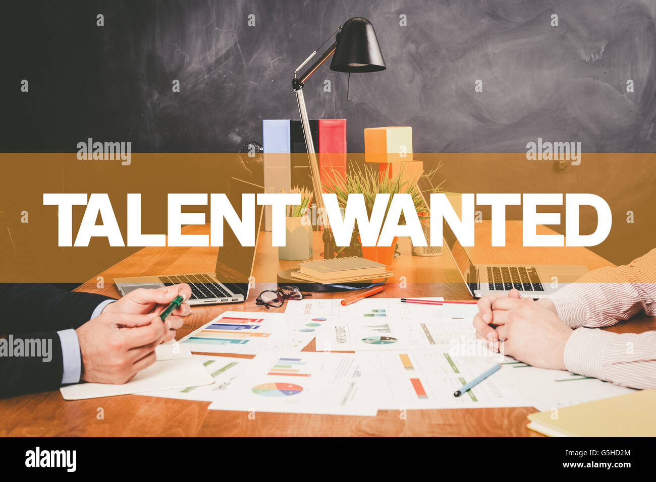 Two Businessman Talent Wanted working in an office Stock Photo - Alamy