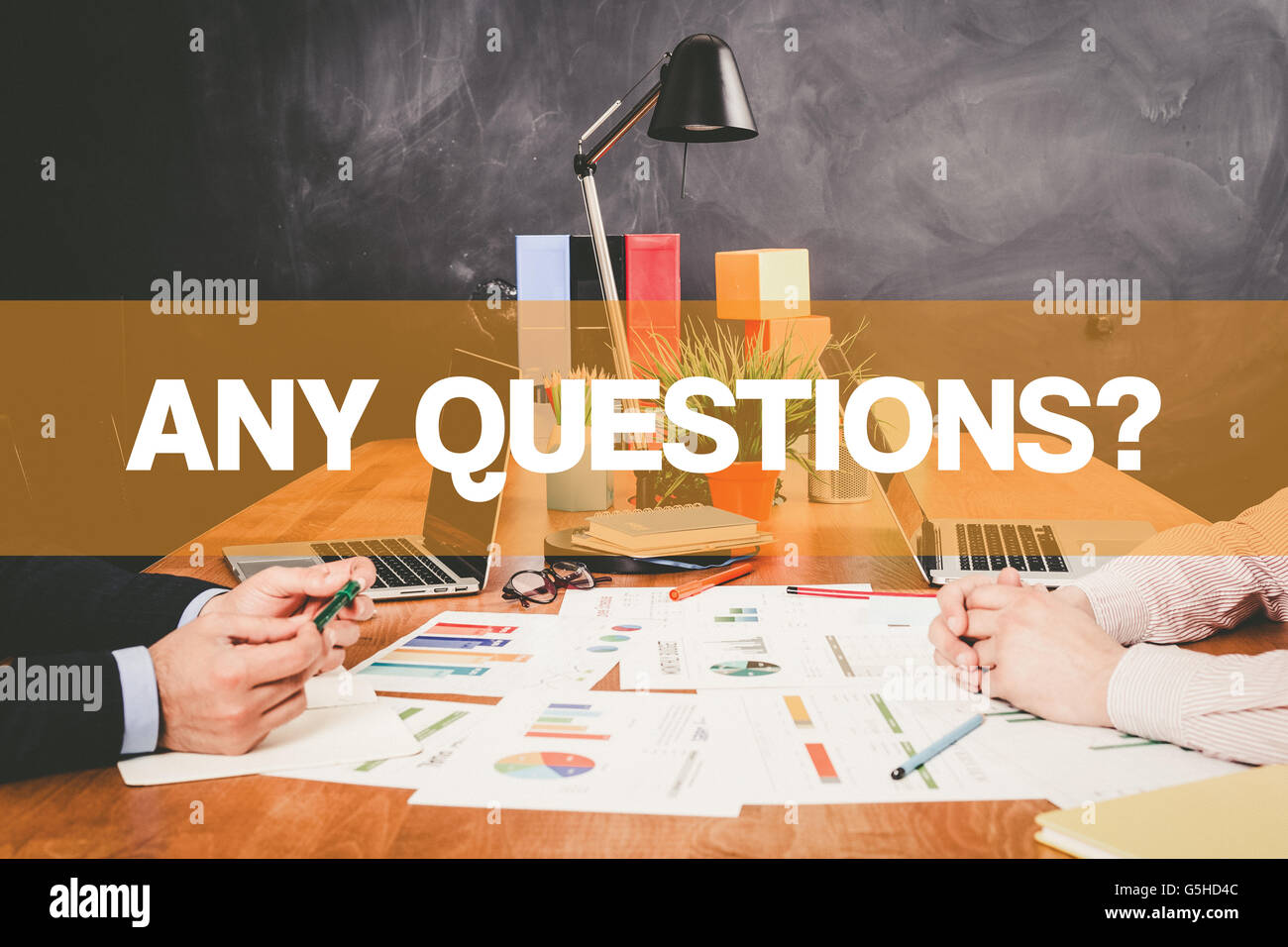 Two Businessman Any Questions? working in an office Stock Photo - Alamy