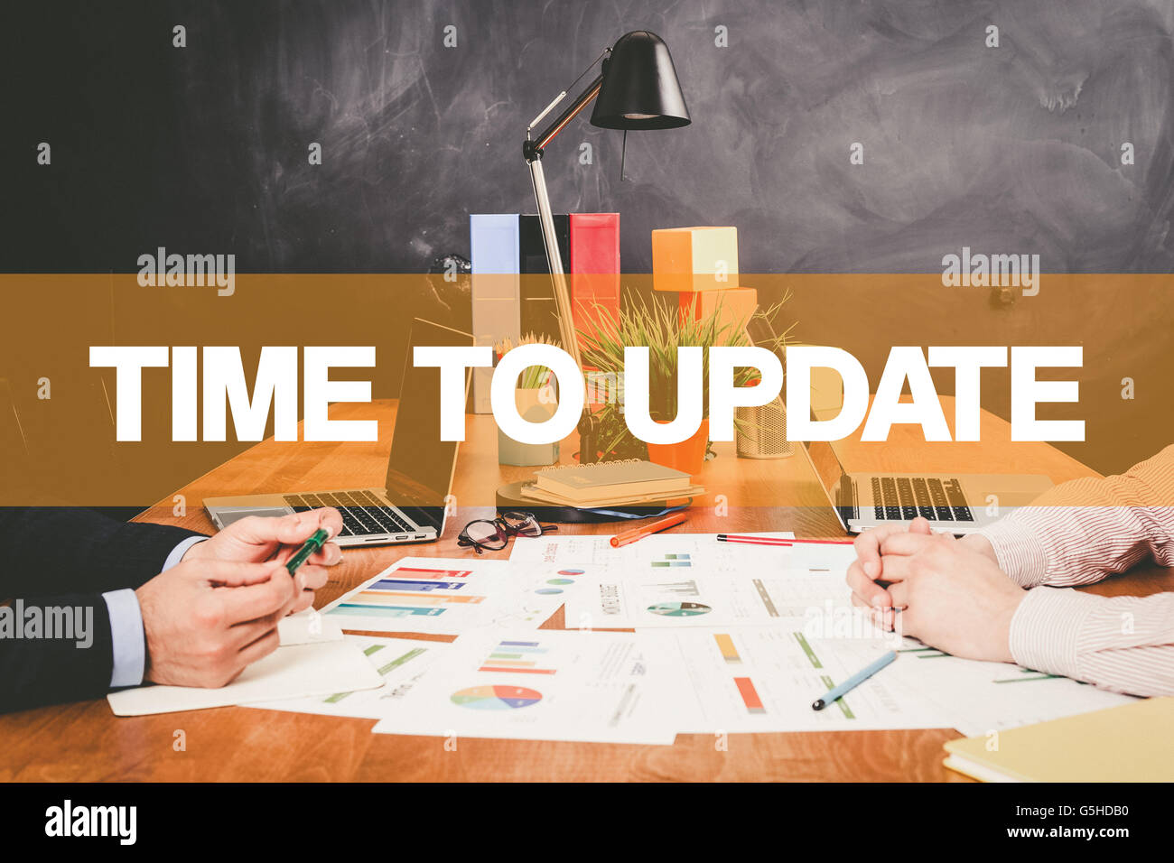 Two Businessman Time To Update working in an office Stock Photo - Alamy