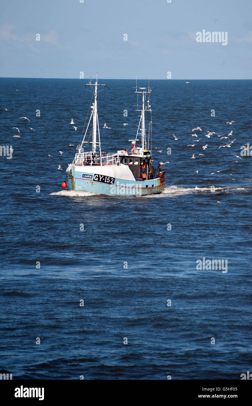 Trawler entering harbour hi-res stock photography and images - Alamy