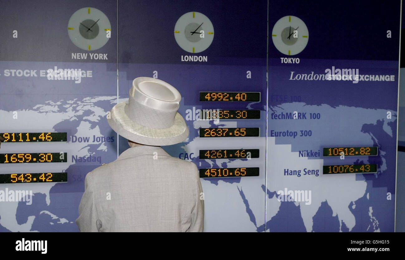 Britain's Queen Elizabeth II looks at the world stock markets at the ...