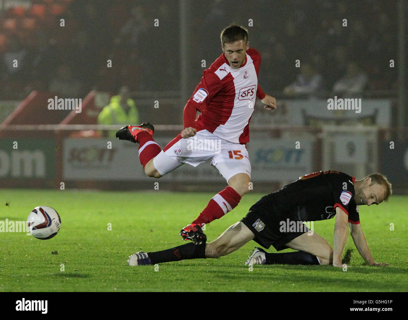 Crawley's Dannie Bulman is challenged by MK Don's Luke Chadwick during ...
