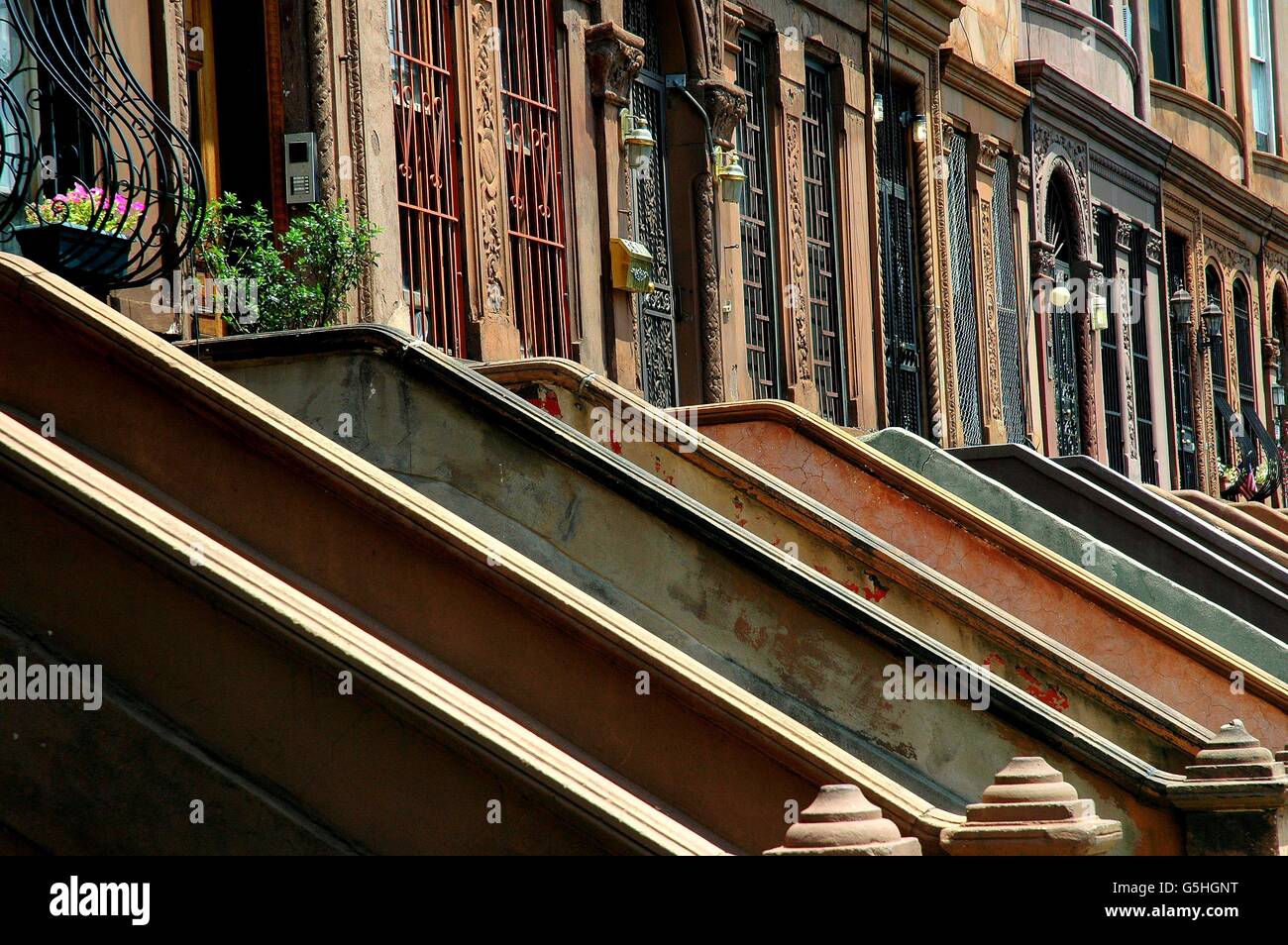 New York City: Classic Harlem brownstones with stoops and window grills ...