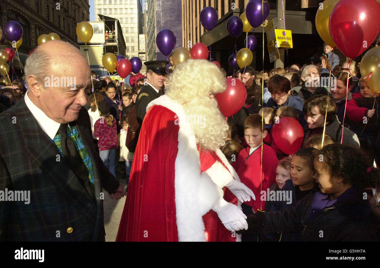 Harrods chairman Mohamed Al Fayed (L) and Father Christmas meet ...