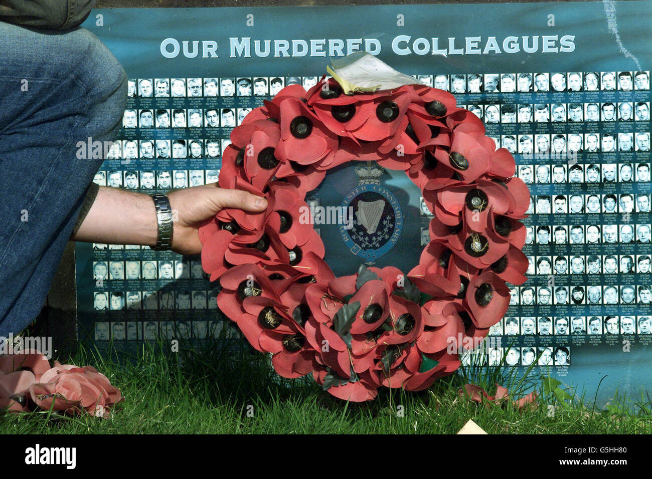 A poppy wreath beside a remembrance poster at the Stormont Estate ...