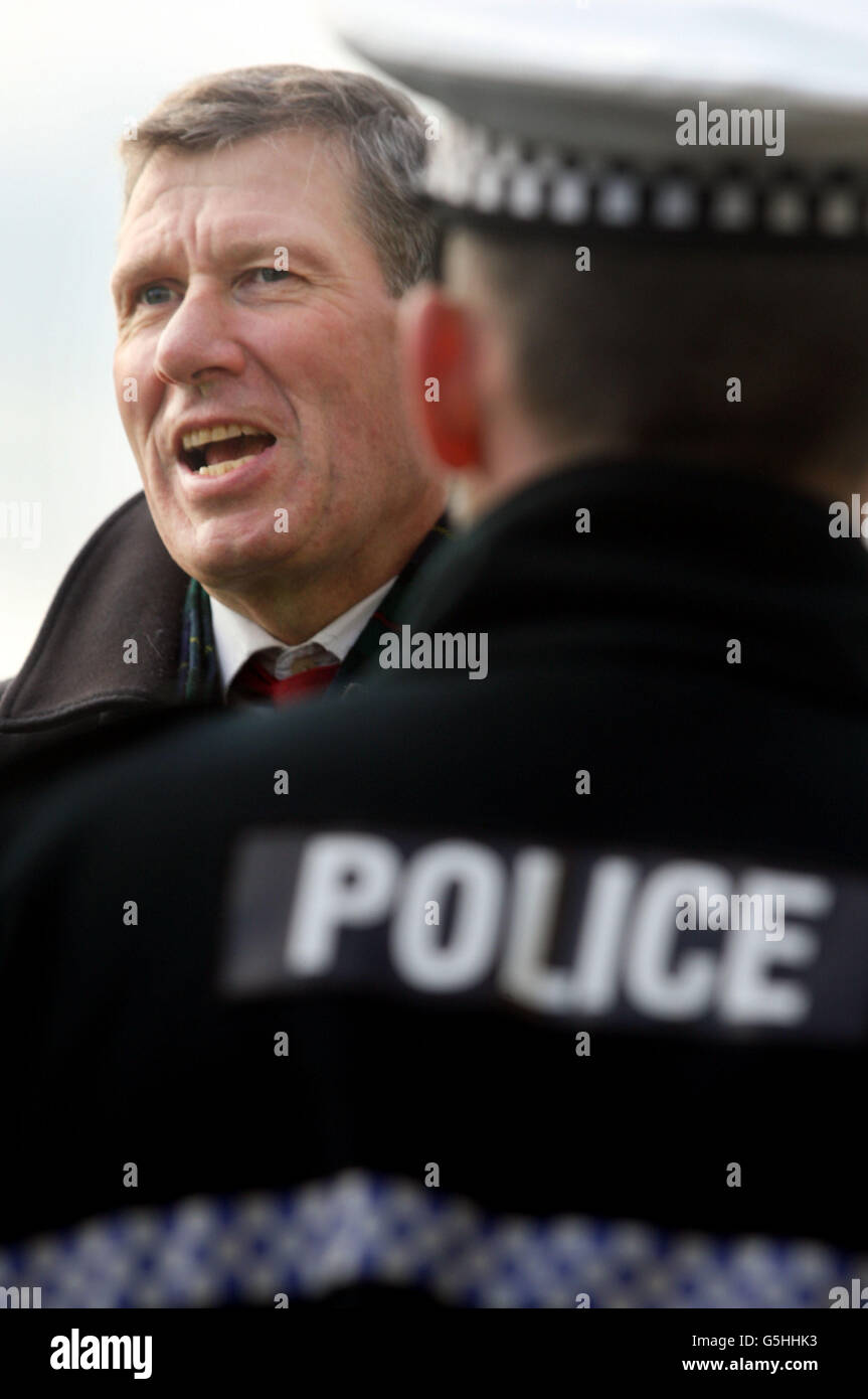Scottish Justice Secretary Kenny MacAskill talks to police officers in ...