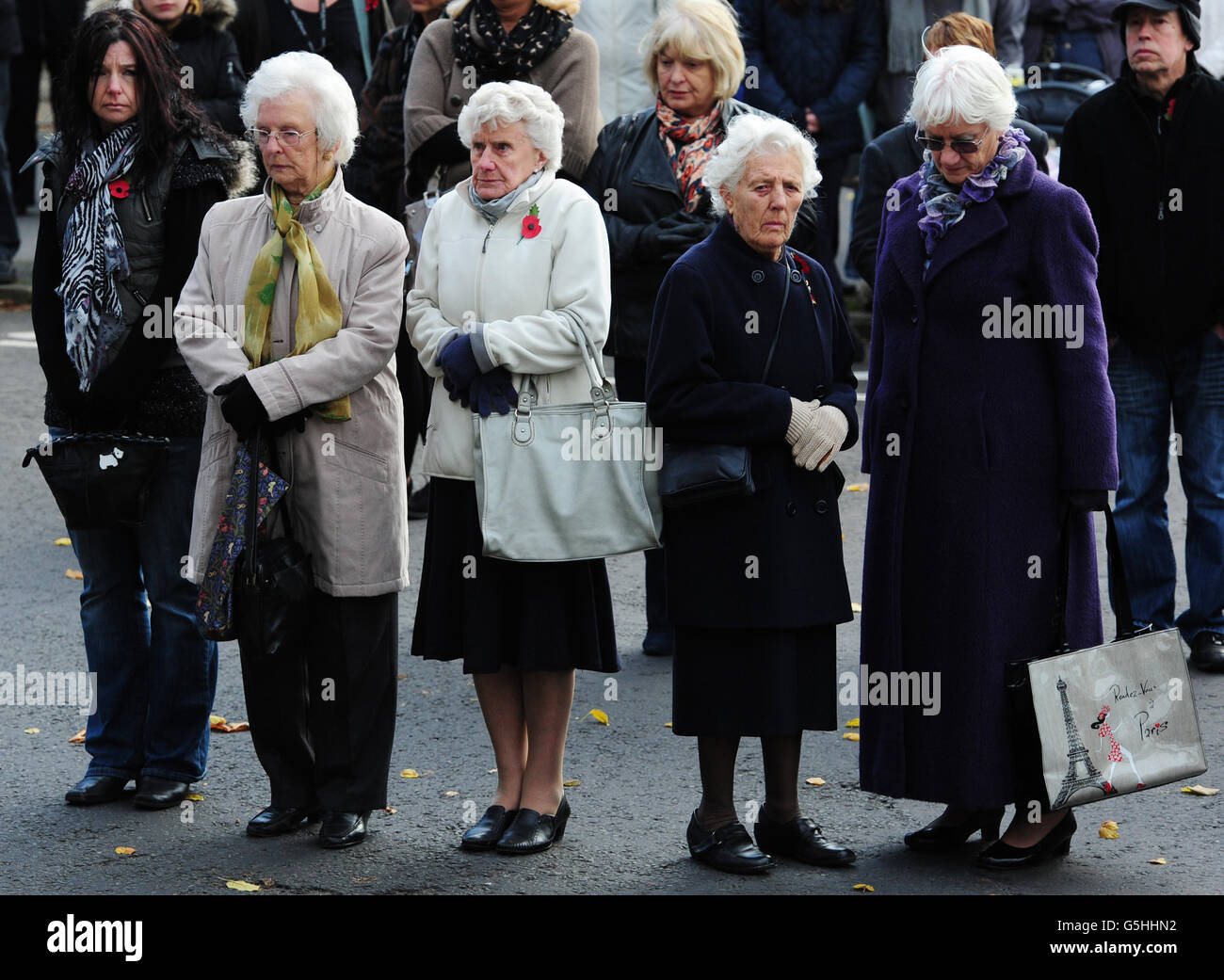 Mourners stand outside church during the funeral service of Sergeant ...