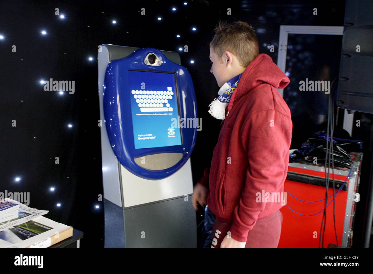 A member of the public uses an Everton FC computer booth Stock Photo ...