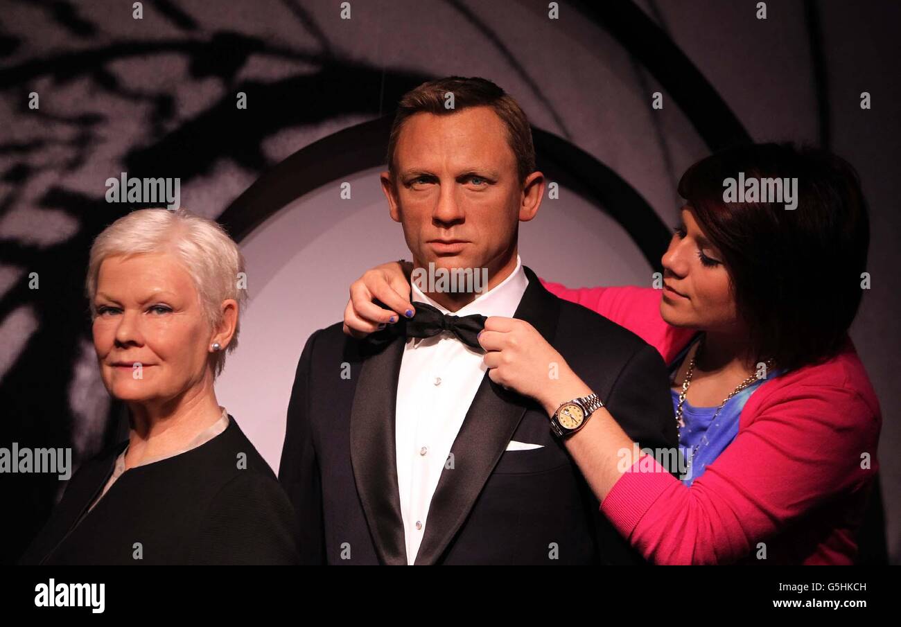 Maddie Lowe applies the final touches to the wax works of Daniel Craig ...