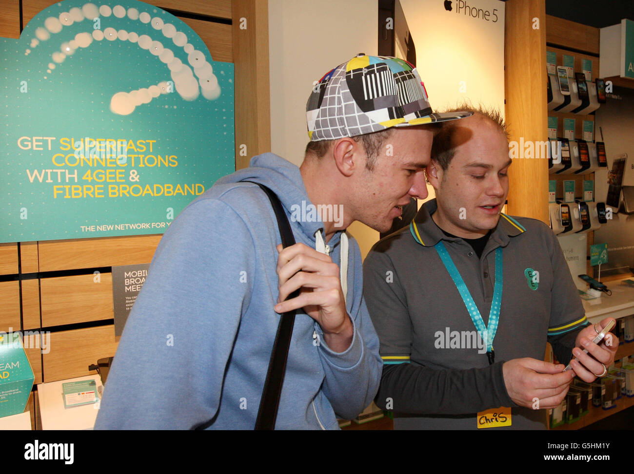 EE salesperson Chris Plank (right) gives Scott Barnard a demonstration ...