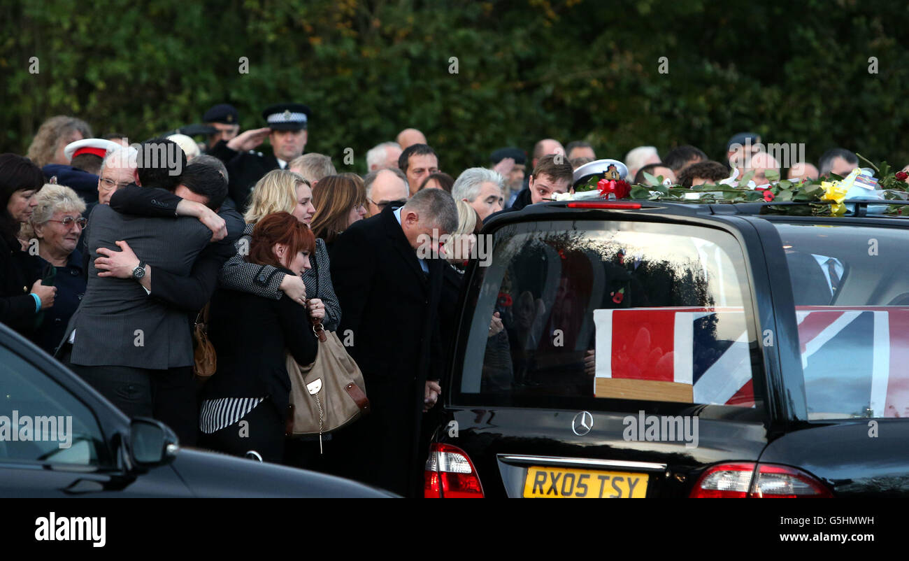Mourners lay flowers on the hearse carrying Corporal David O'Connor ...