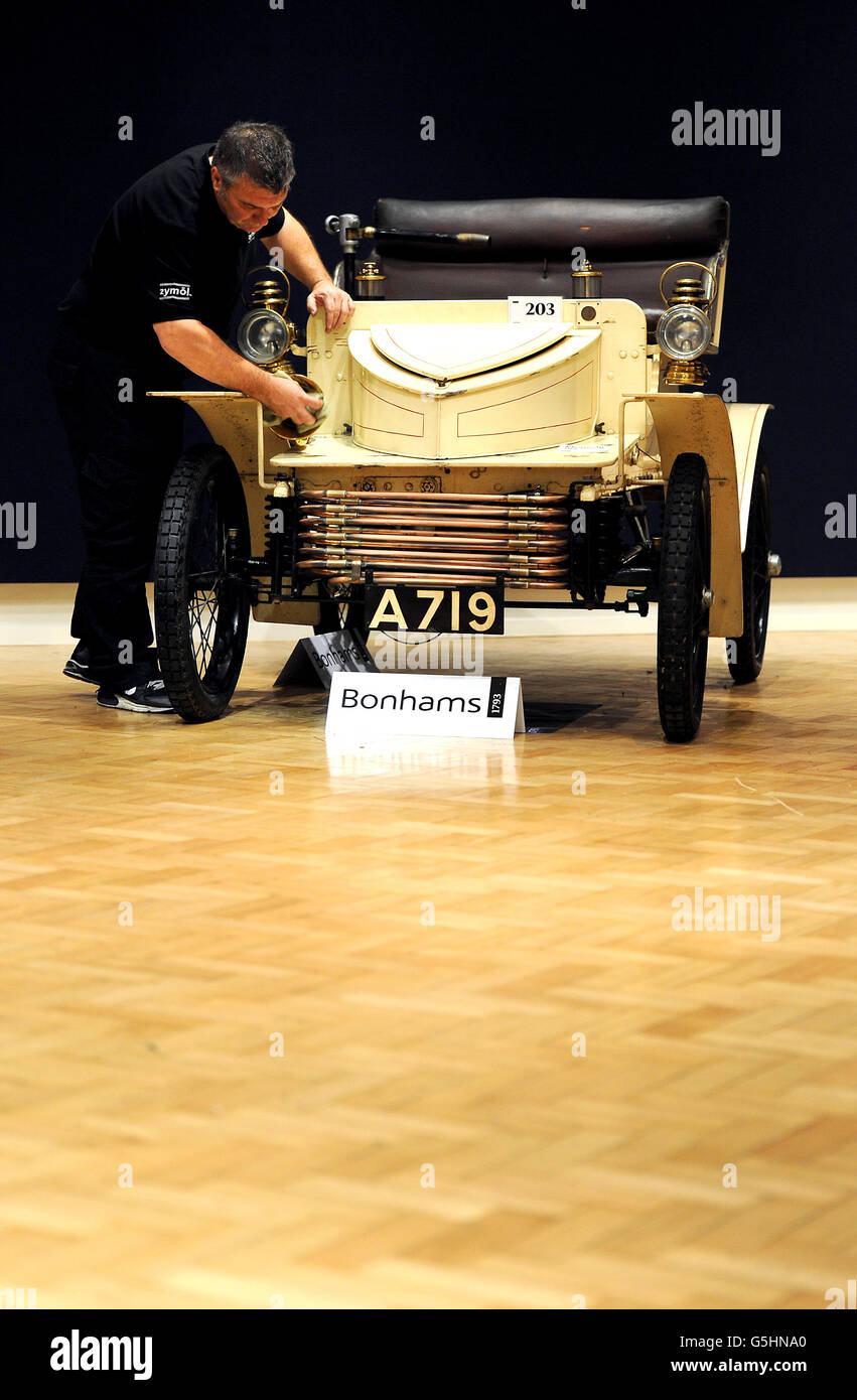 Craig Binns, owner of detailing company Parc Ferme, polishes a lamp on ...