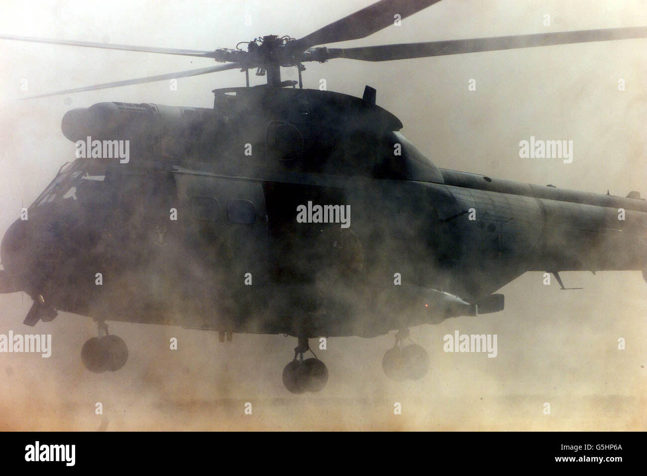 A Puma helicopter of RAF 33 Squadron takes off from Camp Eagle whilst ...