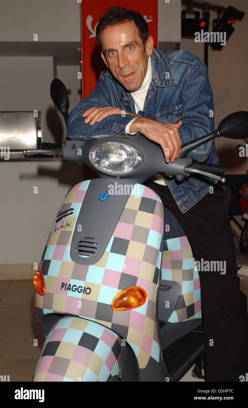Designer Ben Di Lisi, sitting on the bike he designed, at an auction of ...