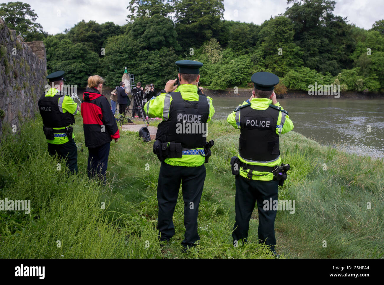 PSNI Officers film and photograp pro-choice activists as they wait for ...