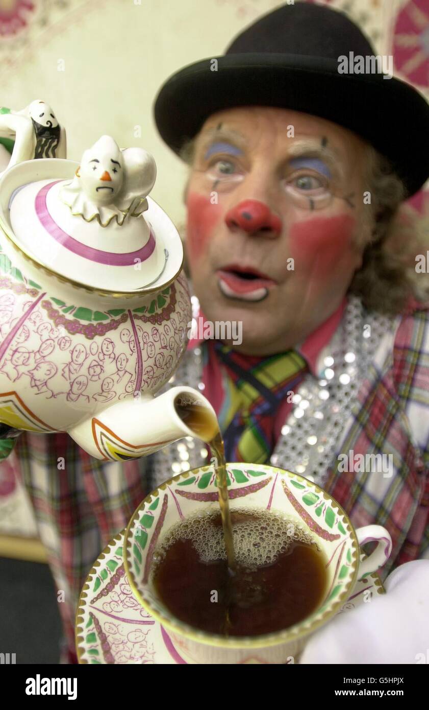 Charlie the clown pours himself a cup of tea from a clown and circus ...