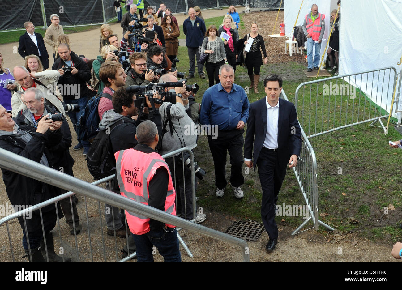 Labour leader Ed Miliband (right) arrives to speak on stage at Hyde ...