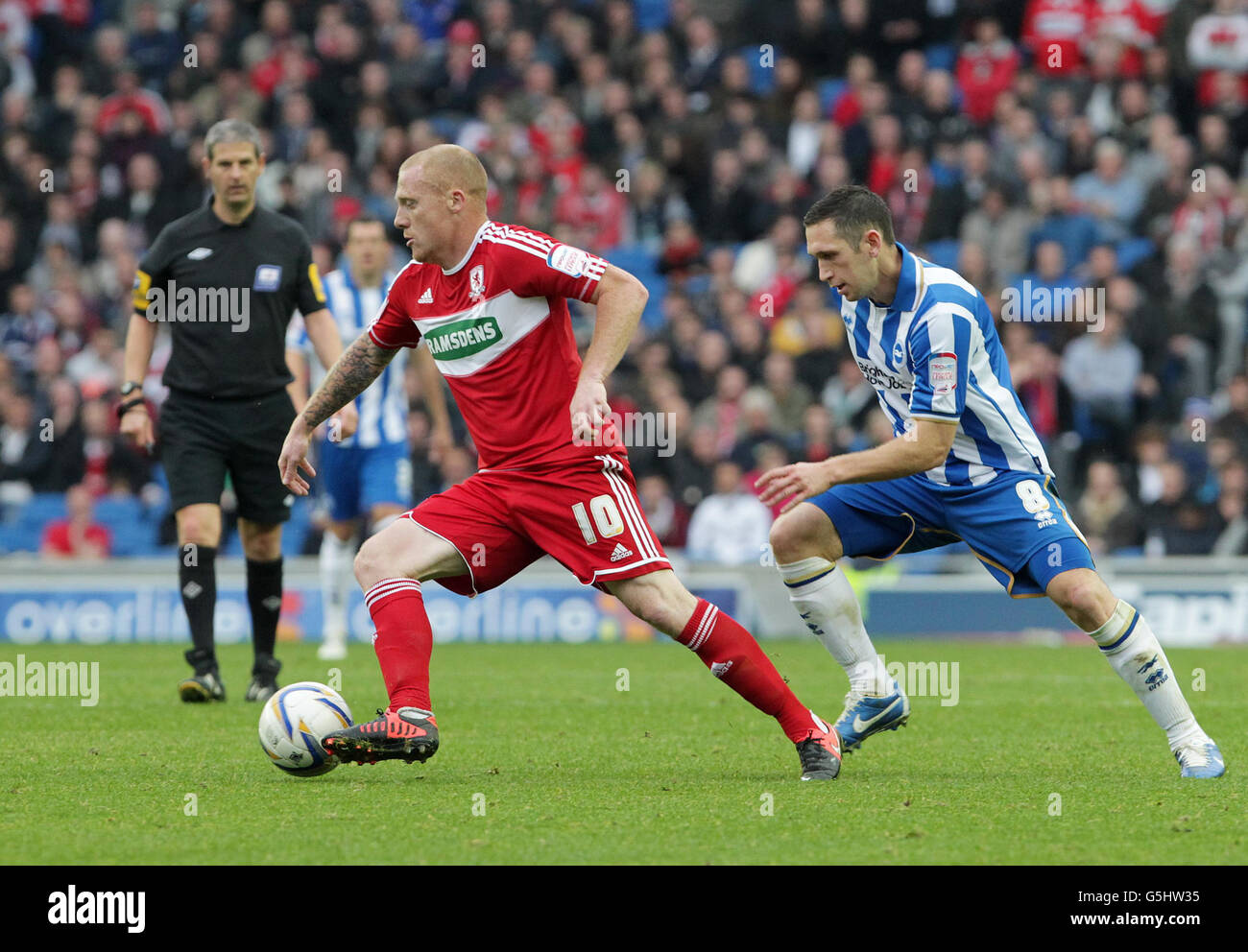 Middlesbrough's Nicky Bailey (left) takes on Brighton's Andrew Crofts ...