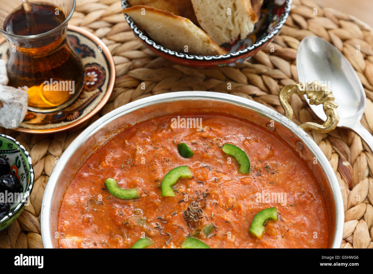 Menemen Turkish breakfast food egg, tomatoes and pepper in pan with ...