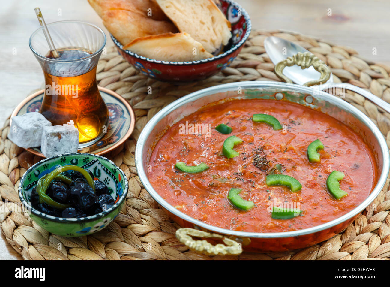 Menemen Turkish breakfast food egg, tomatoes and pepper in pan with ...