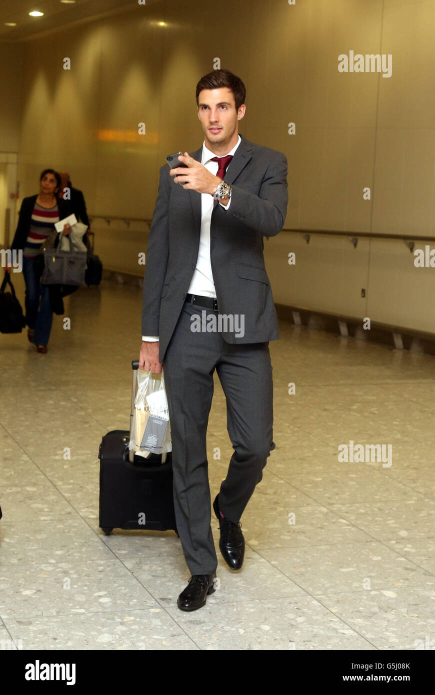England Steve Finn arrives at Terminal 3 of Heathrow Airport to catch a ...