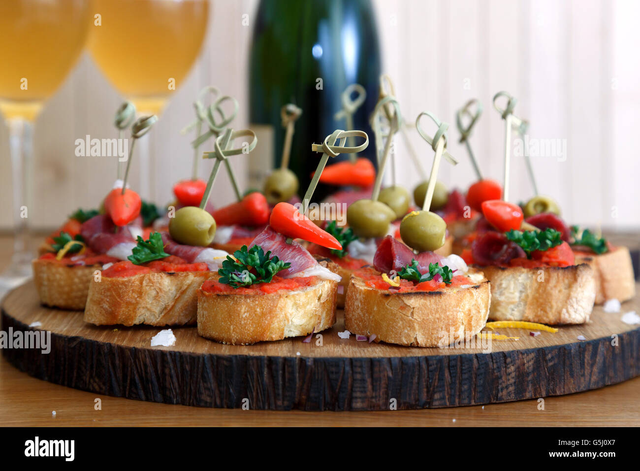 Tapas on Crusty Bread - Selection of Spanish tapas served on a sliced ...
