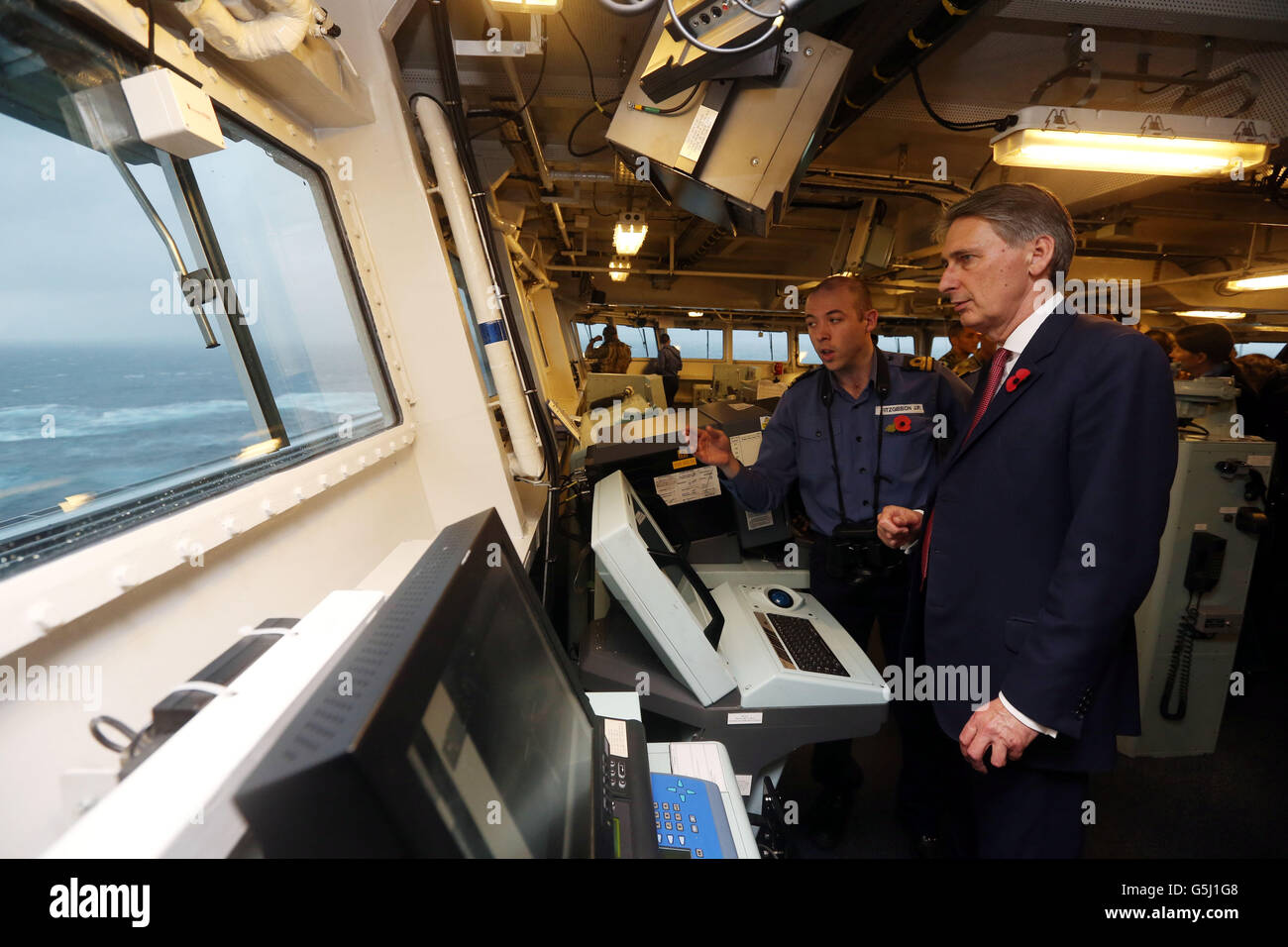 Defence Secretary Philip Hammond (right) talks to Lieutenant John-Paul ...
