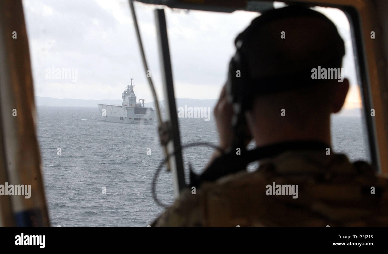 A Royal Navy Force Protection officer on board HMS Bulwark looks at a ...